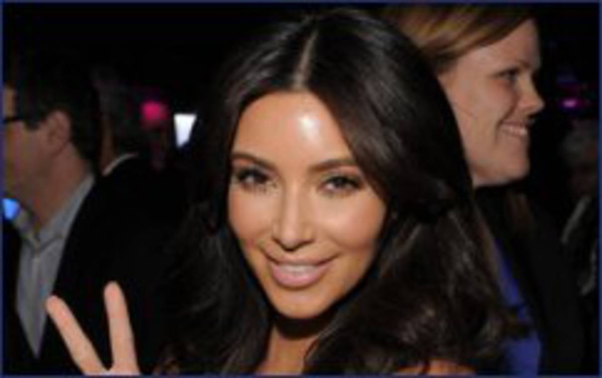 Kim Kardashian flaunts her post-baby body in skimpy white bathing suit ...